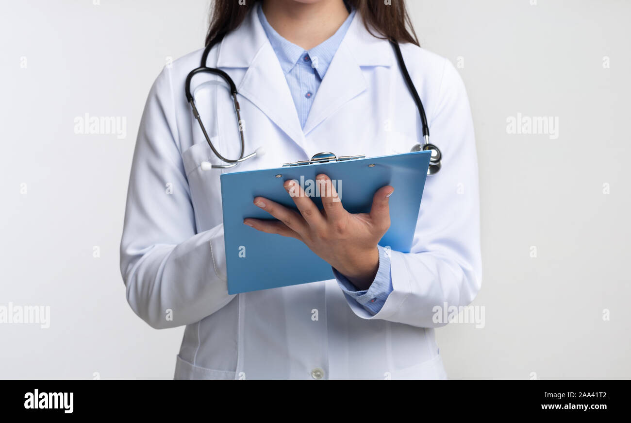 Doctor writing chart report hi-res stock photography and images - Alamy