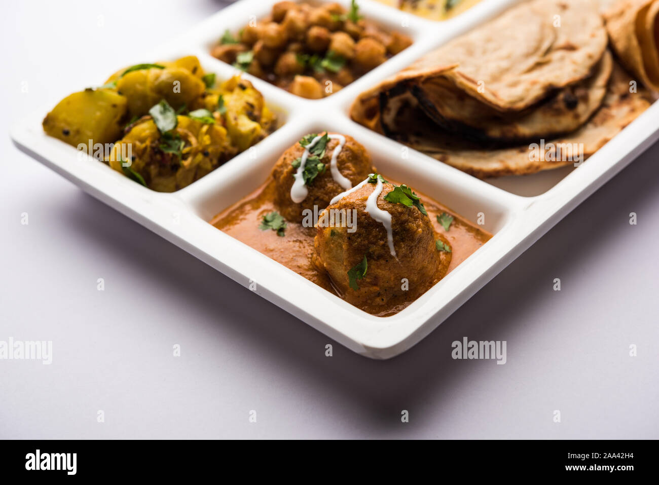 Indian vegetarian Food Thali or Parcel food-tray with compartments in ...