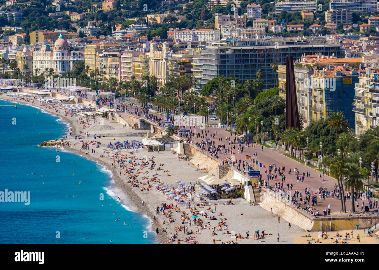 NICE, FRANCE - OCTOBER 6, 2019: Unidentified people on the beach and ...