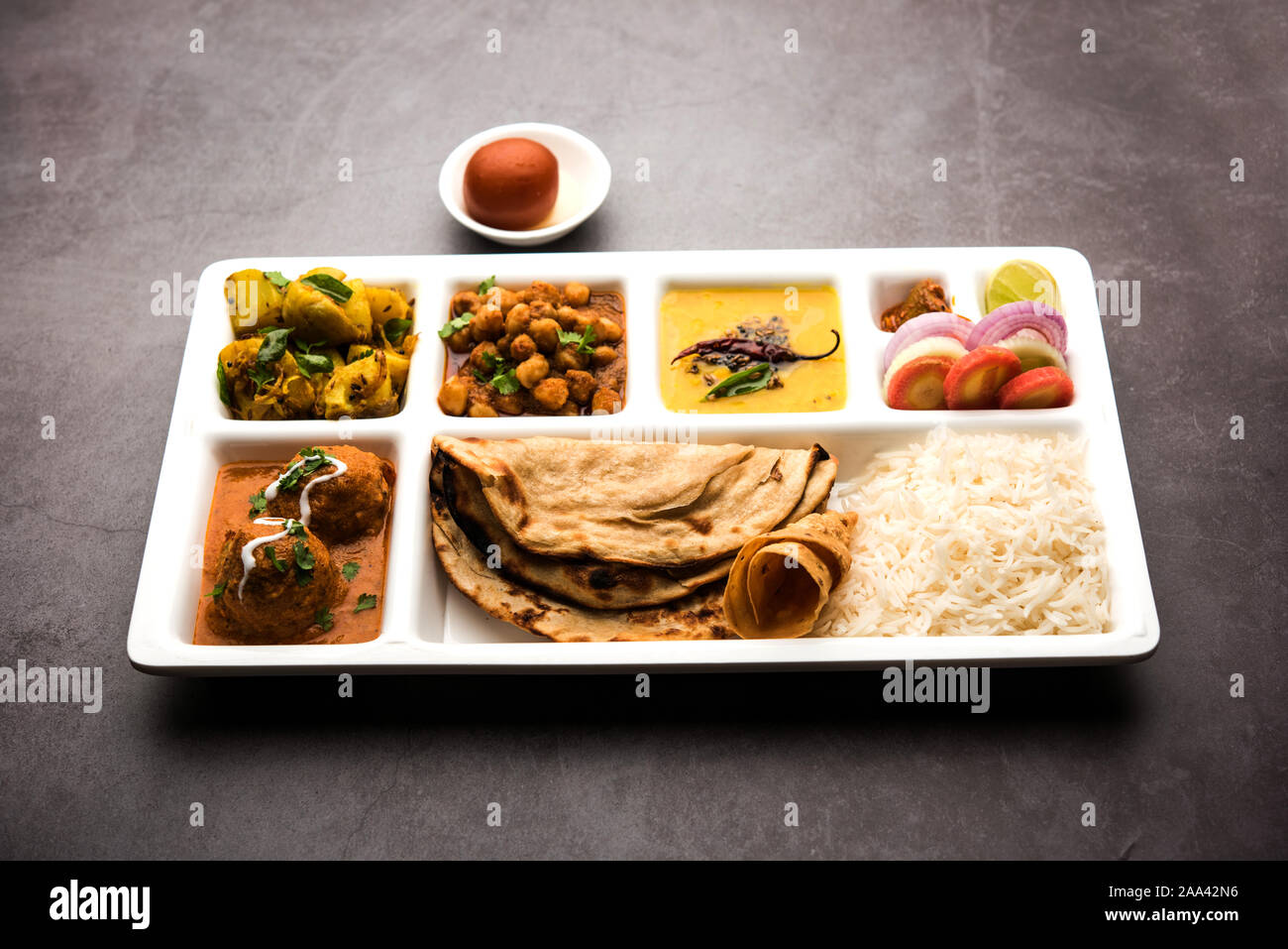 Indian Vegetarian Food Thali Or Parcel Food tray With Compartments In indian-vegetarian-food-thali-or-parcel-food-tray-with-compartments-in