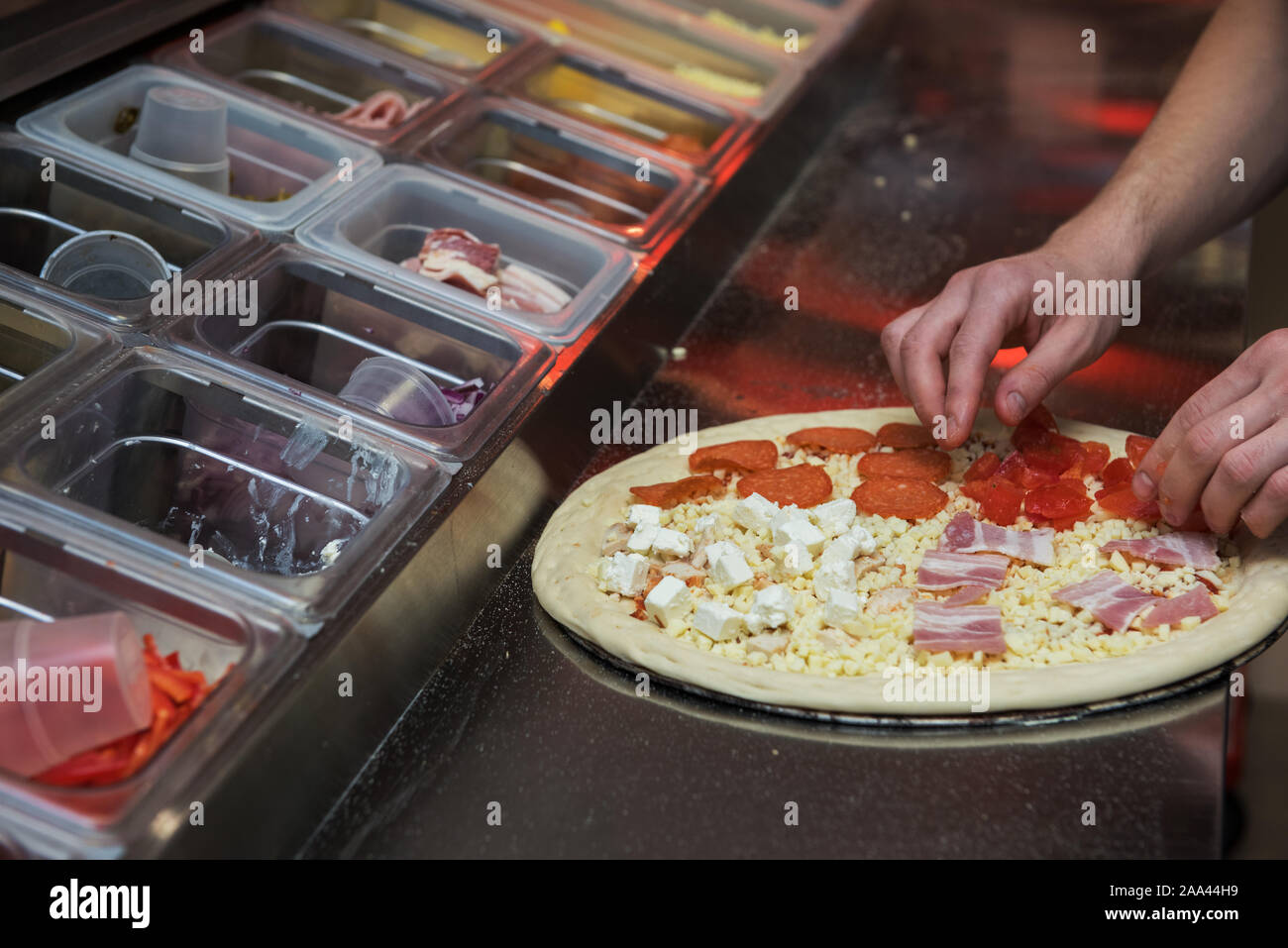 making pizza at kitchen of pizzeria Stock Photo - Alamy