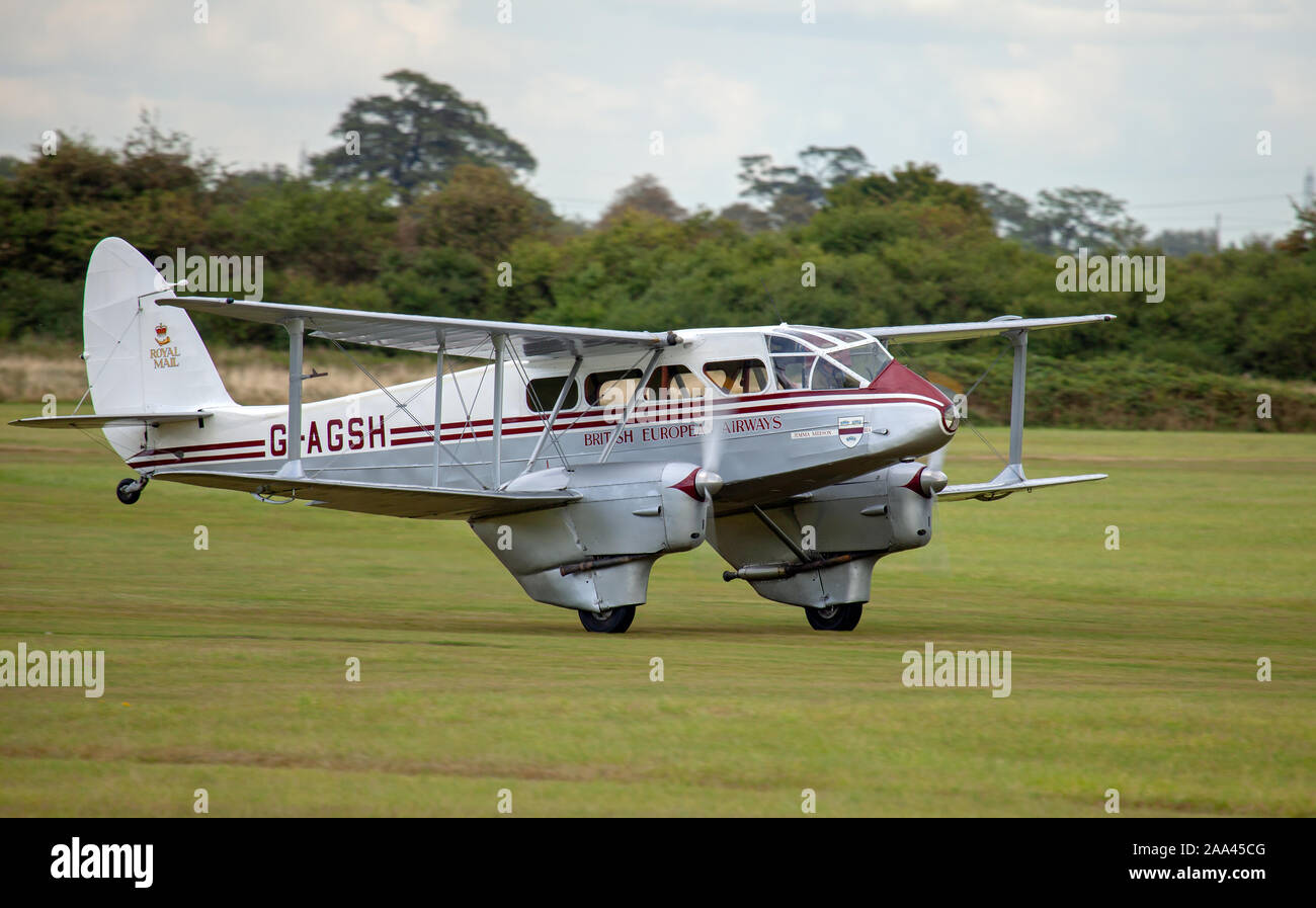 DH-89A Dragon Rapide 6 G-AGSH landing at Old Warden Aerodrome ...