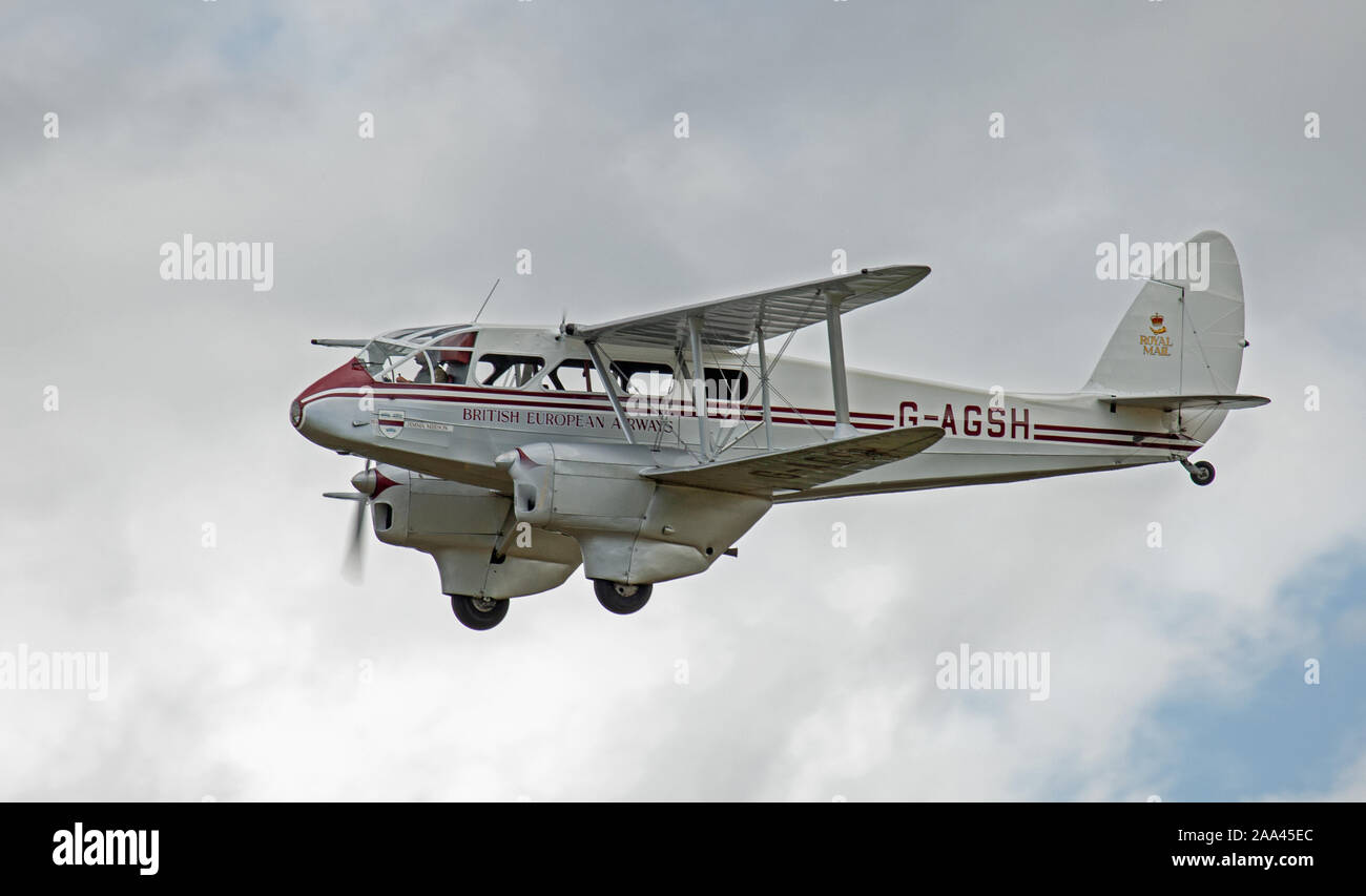 DH-89A Dragon Rapide 6 G-AGSH in flight at Old Warden Aerodrome ...