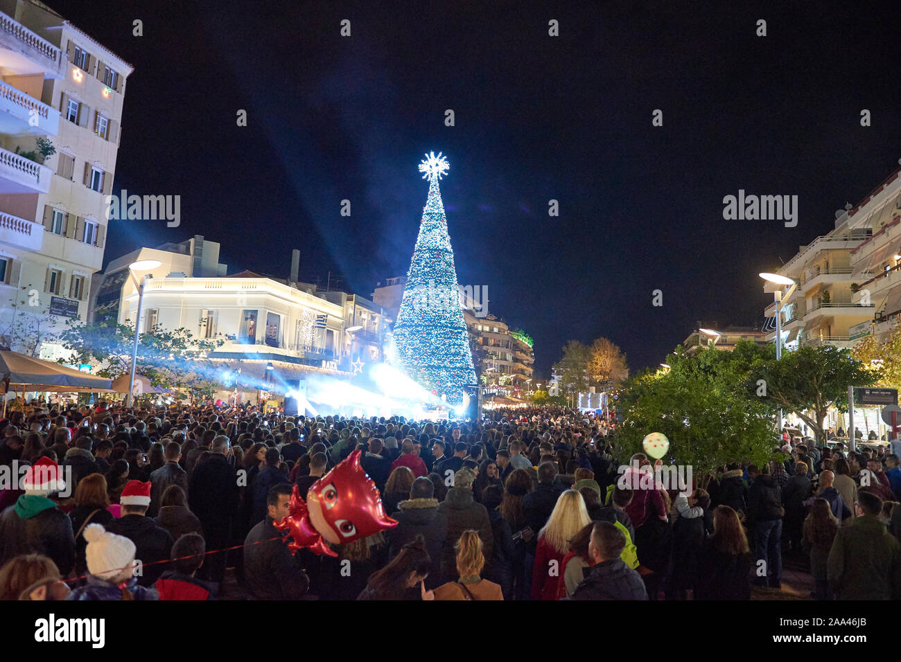 Christmas atmosphere in Kalamata, Greece with people walking by the ...