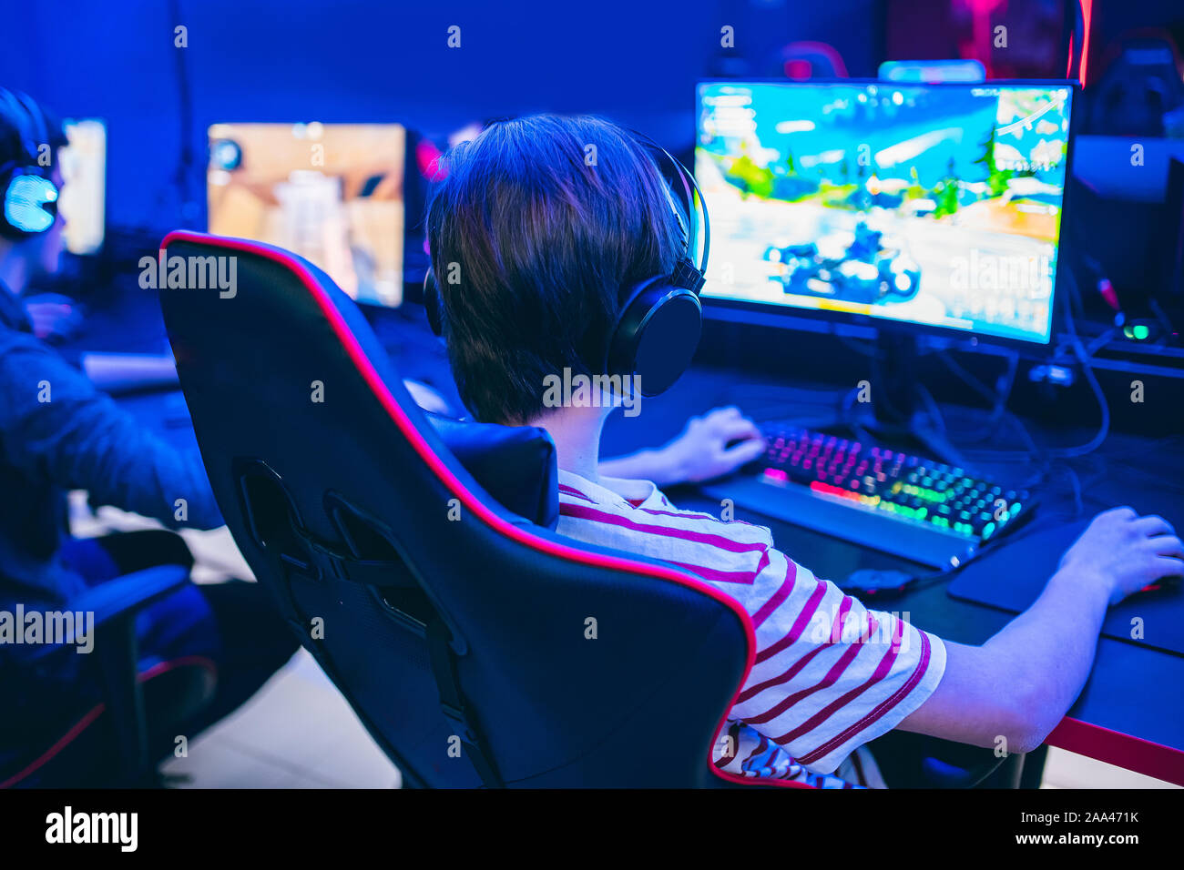 Professional gamer playing tournaments online video games computer with ...