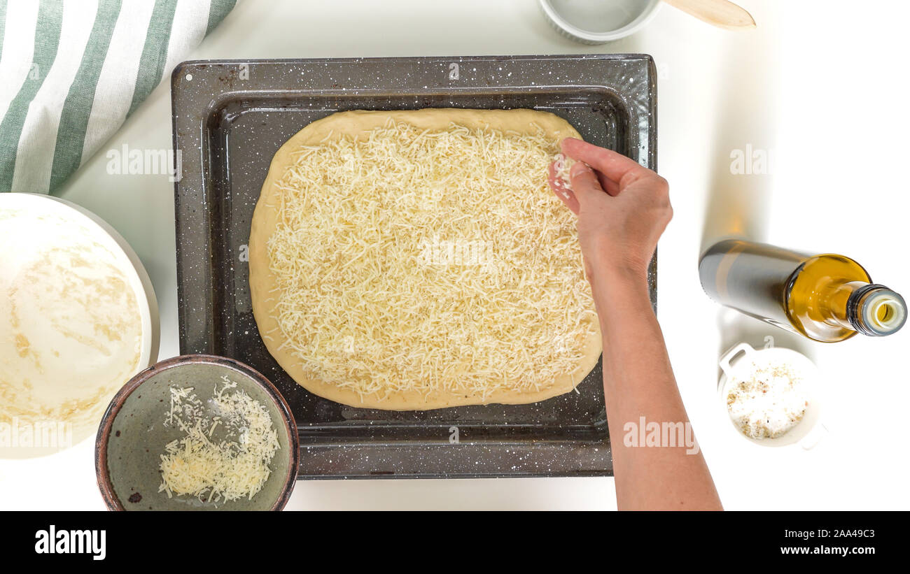 Baking cheese bread step by step. Topping bread dough with cheese ...
