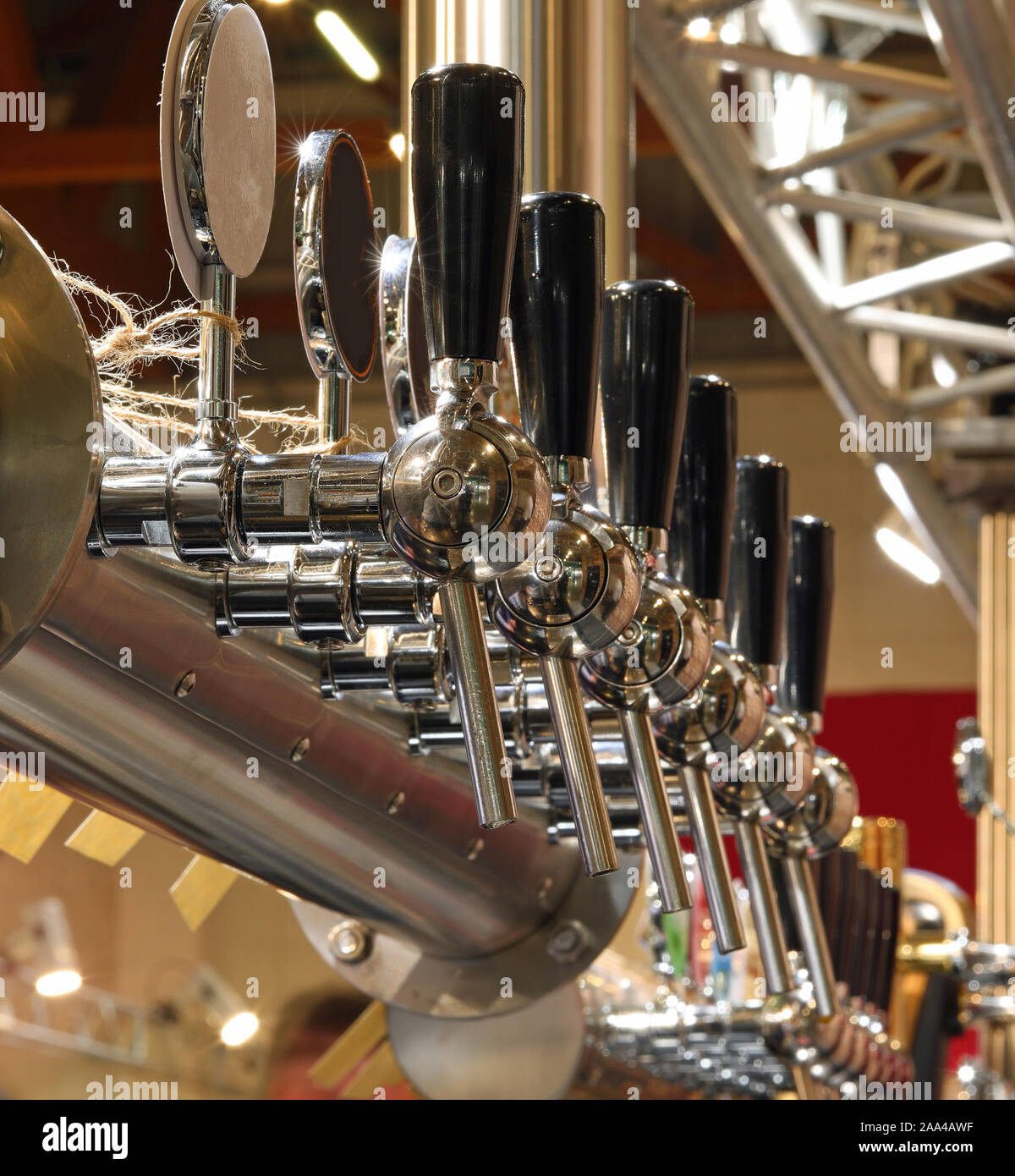 Many taps in stainless steel to draught beer in the pub Stock Photo - Alamy