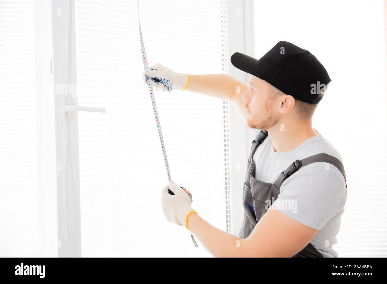 Master worker measures upvc window with ruler, installation process ...