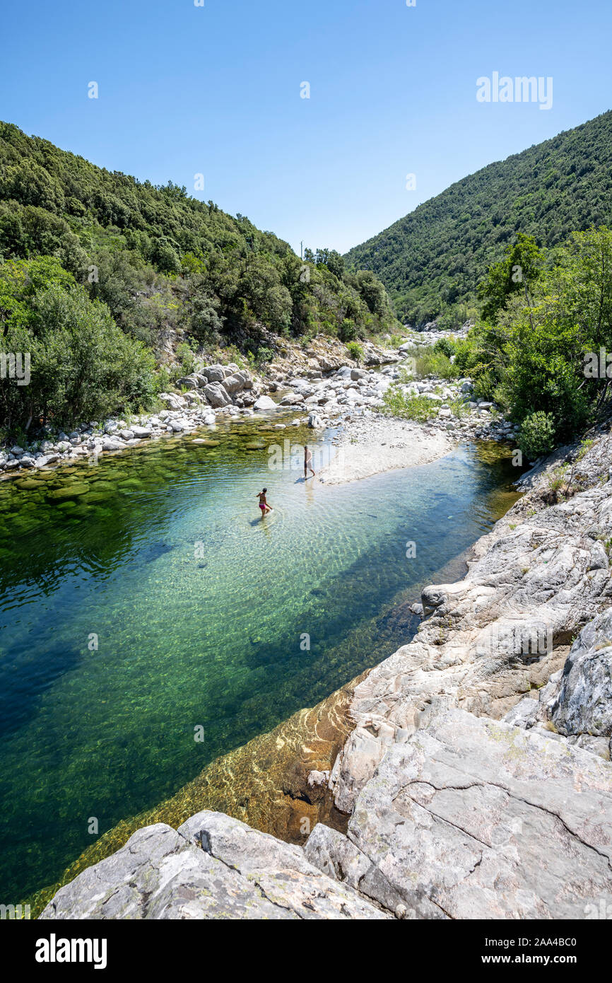 Adult tourists in a Pure and fresh water natural pool of Travu River ...