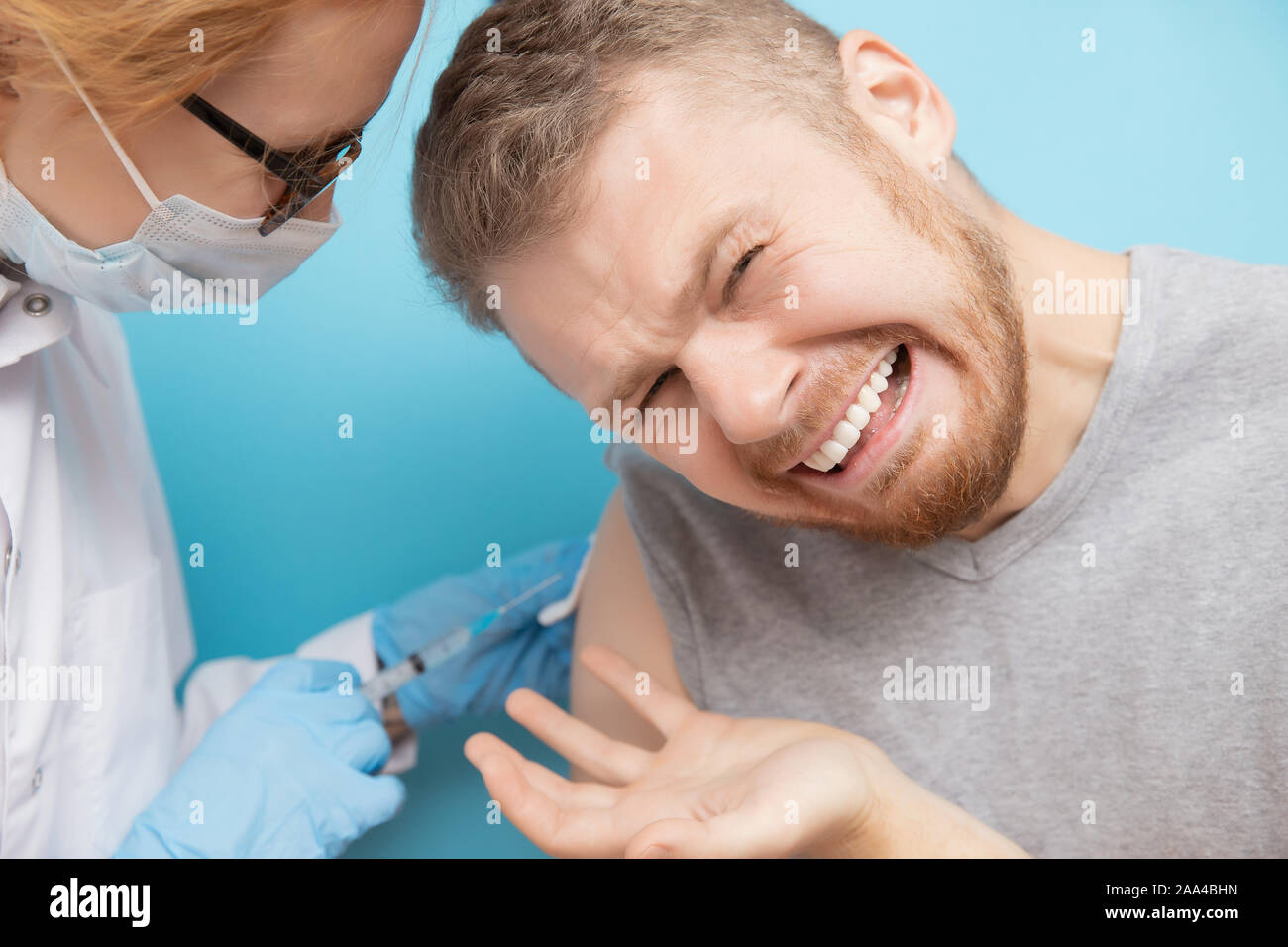 Man is fear and cries from syringe with vaccination doctor appointment ...