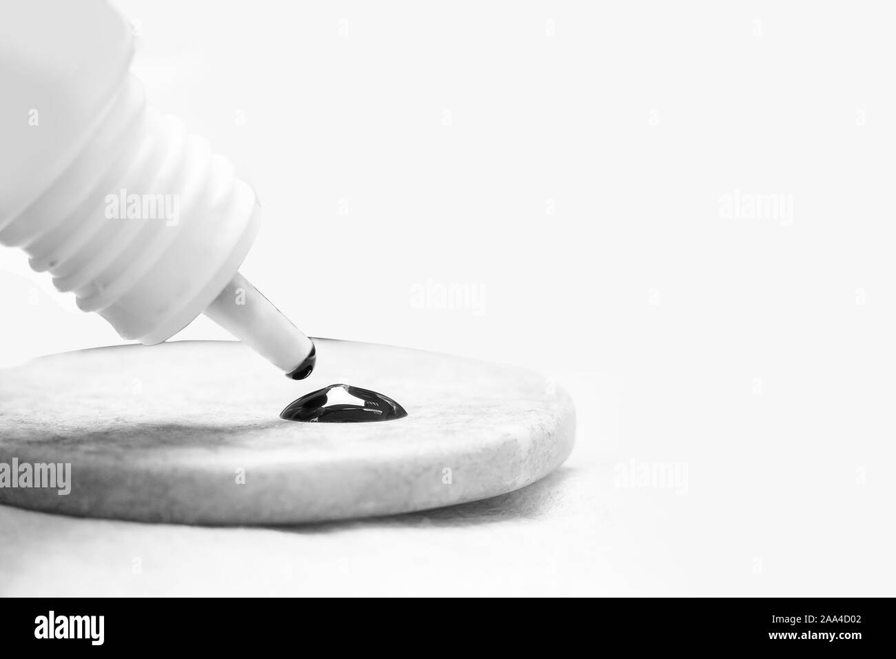 Master puts drop of glue for eyelashes extension procedure Stock Photo ...