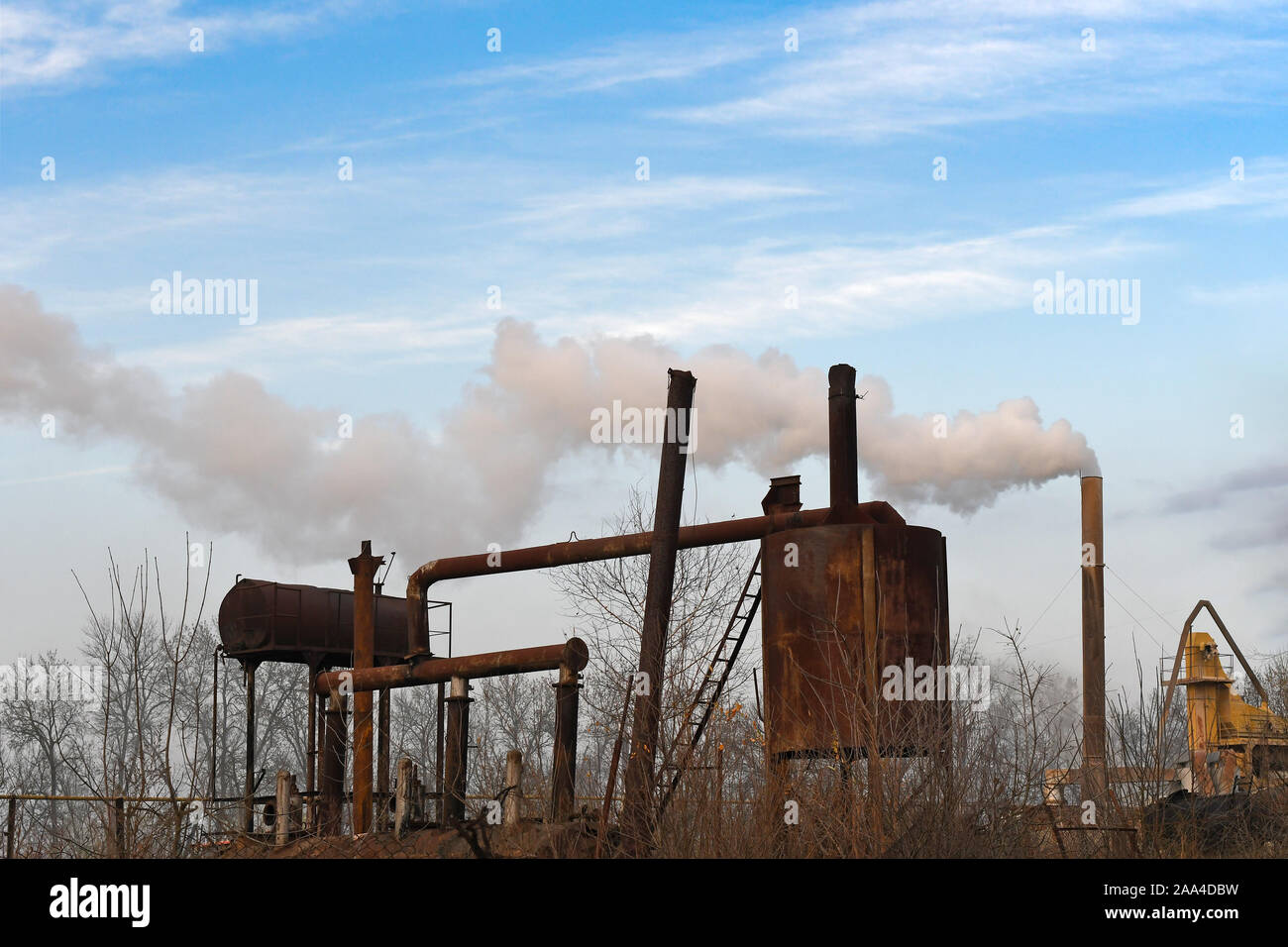 smoke, air emissions from an industrial pipe against trees. Pollution ...