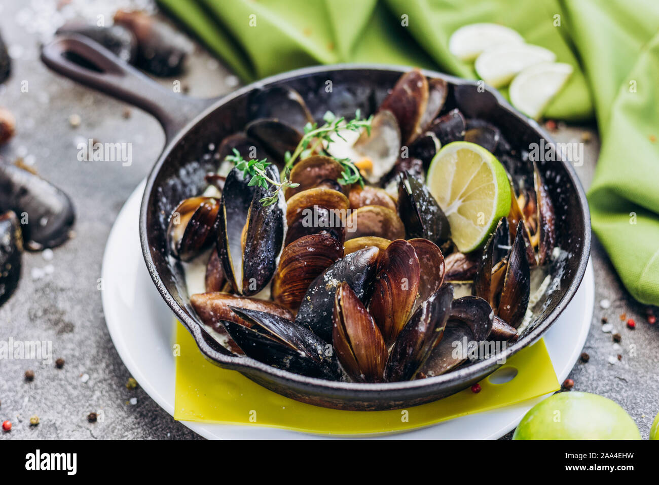 Baked Mediterranean mussels with creamy lime sauce Stock Photo - Alamy