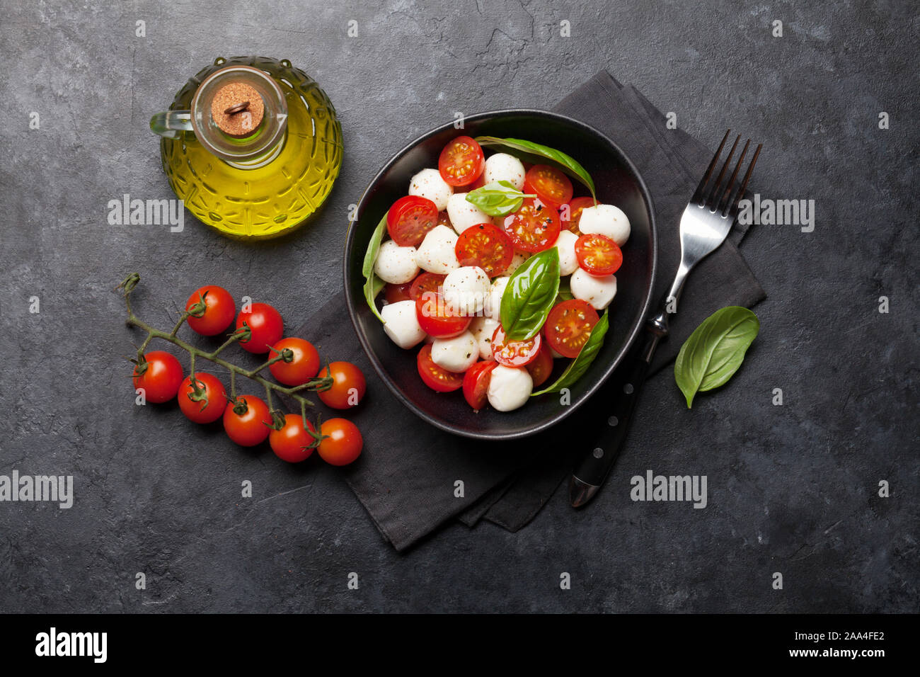 Fresh classic caprese salad with cherry tomatoes, mozzarella, basil ...