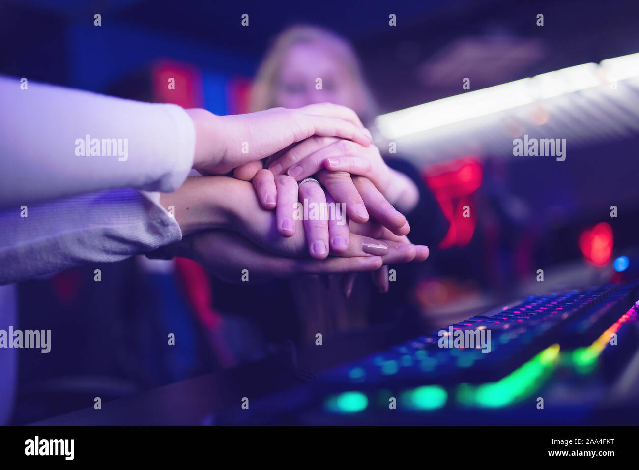 Hand of team man and girl professional gamer playing tournaments online ...