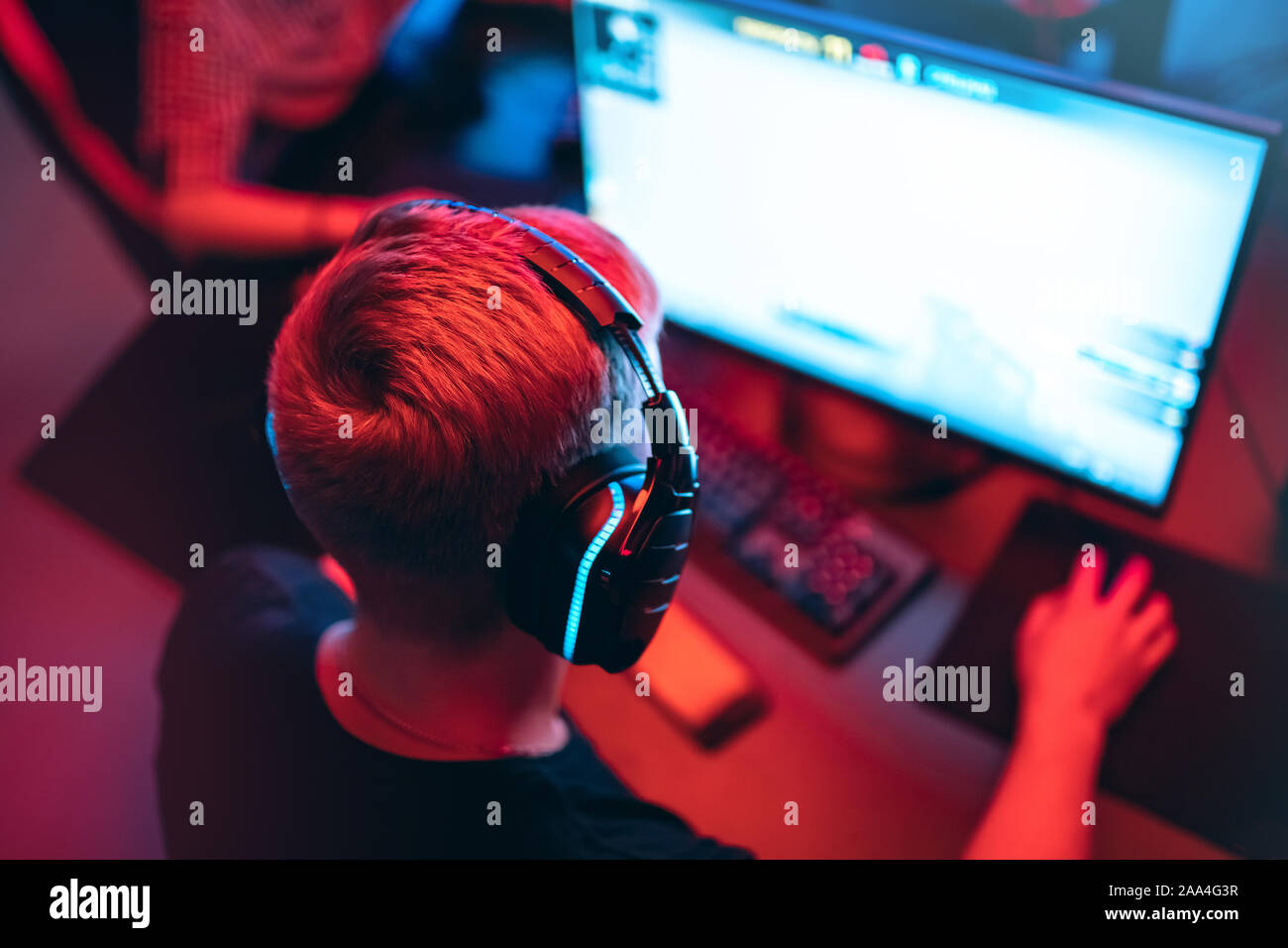Professional gamer playing online games tournaments pc computer with ...