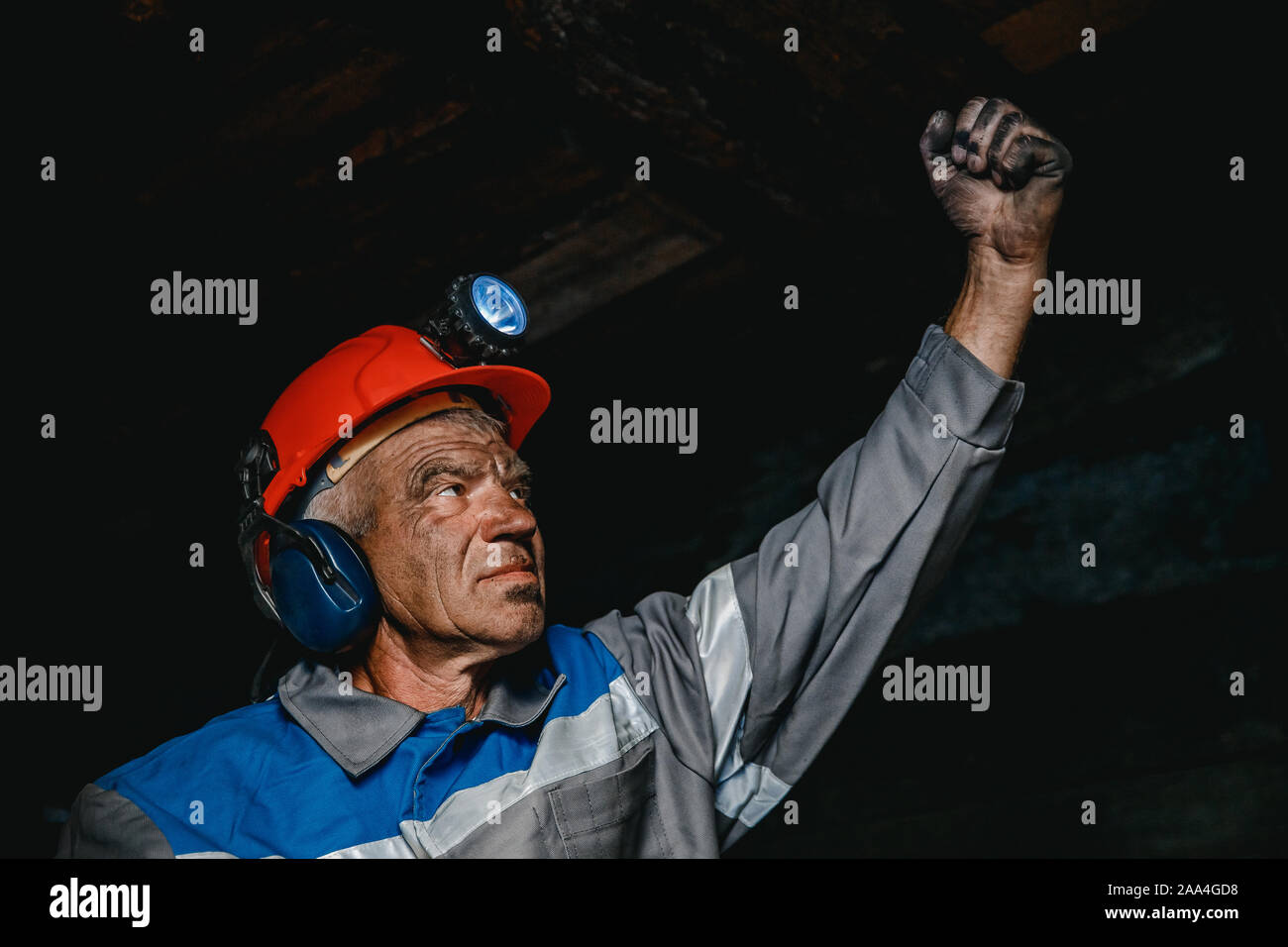 Miner man hands protest fist up revolution coal mine. Concept workers ...