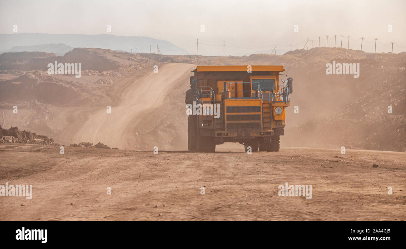 Open pit gold mine, big yellow mining truck moves ore Stock Photo - Alamy