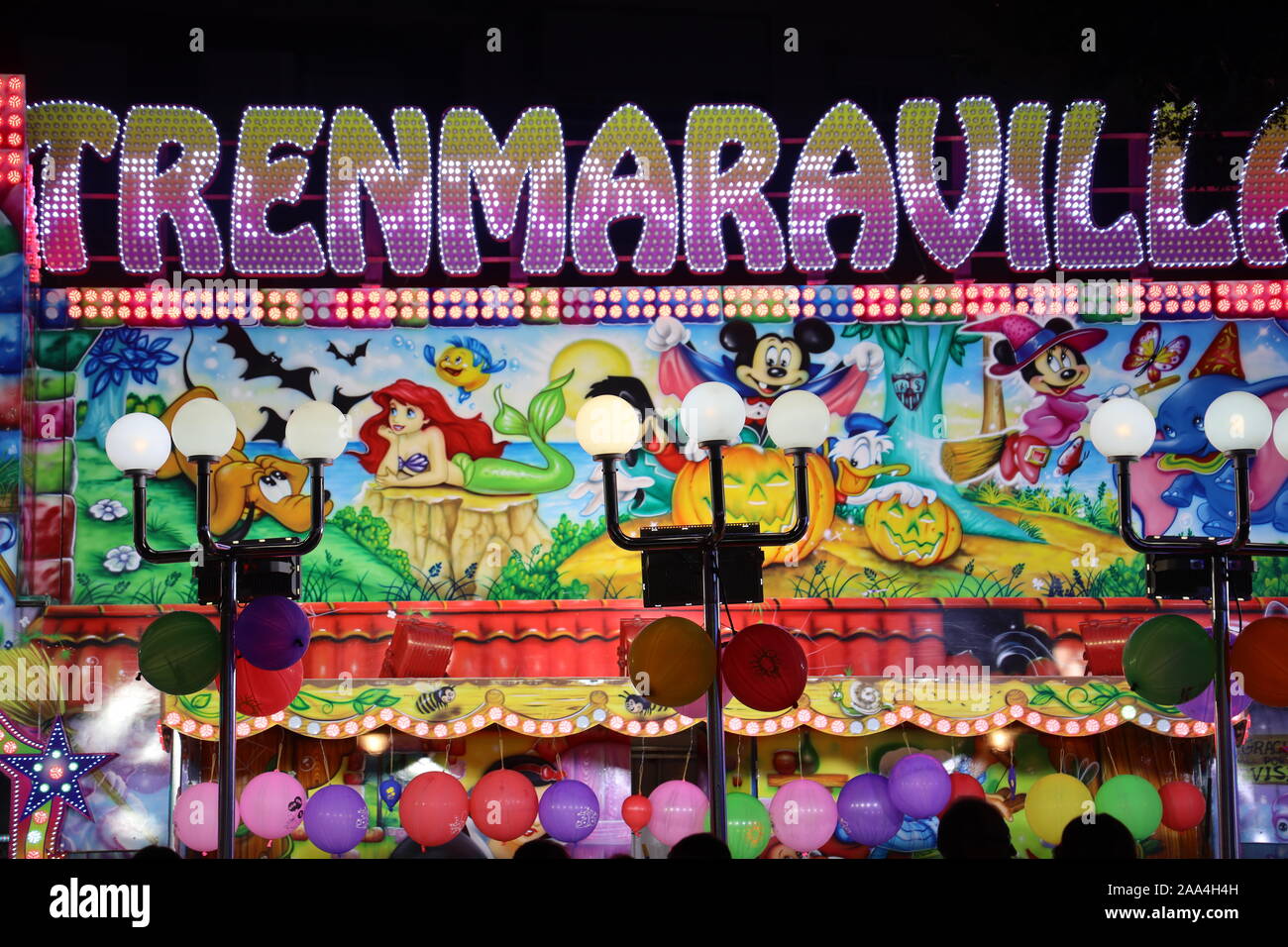 Funfair. Fun fair. Fairground. Colourful stall with stylised Disney ...