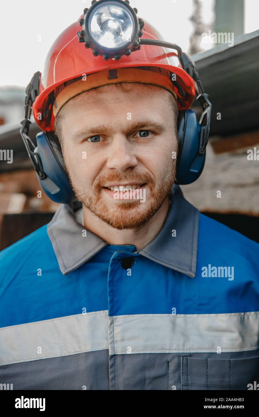Portrait miner coal man in helmet with lantern in underground mine ...