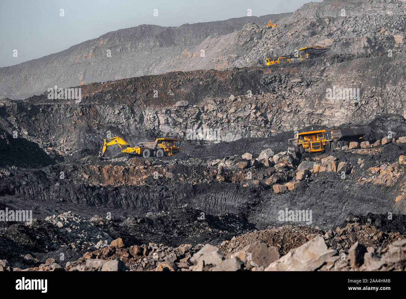 Open pit mine industry. Big yellow mining truck and excavator for coal ...