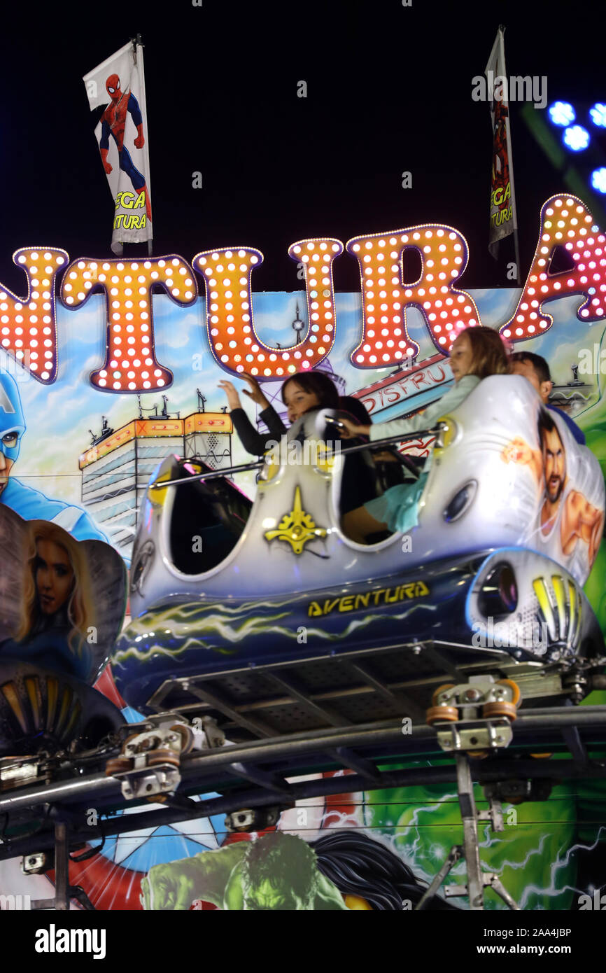 Funfair. Fairground attractions. Colourful Rides. Annual Feria ...