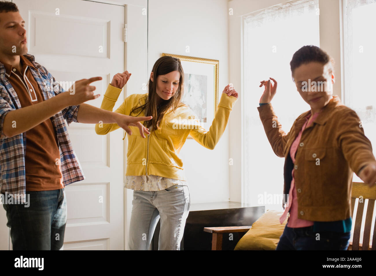 Group of friends dancing Stock Photo - Alamy
