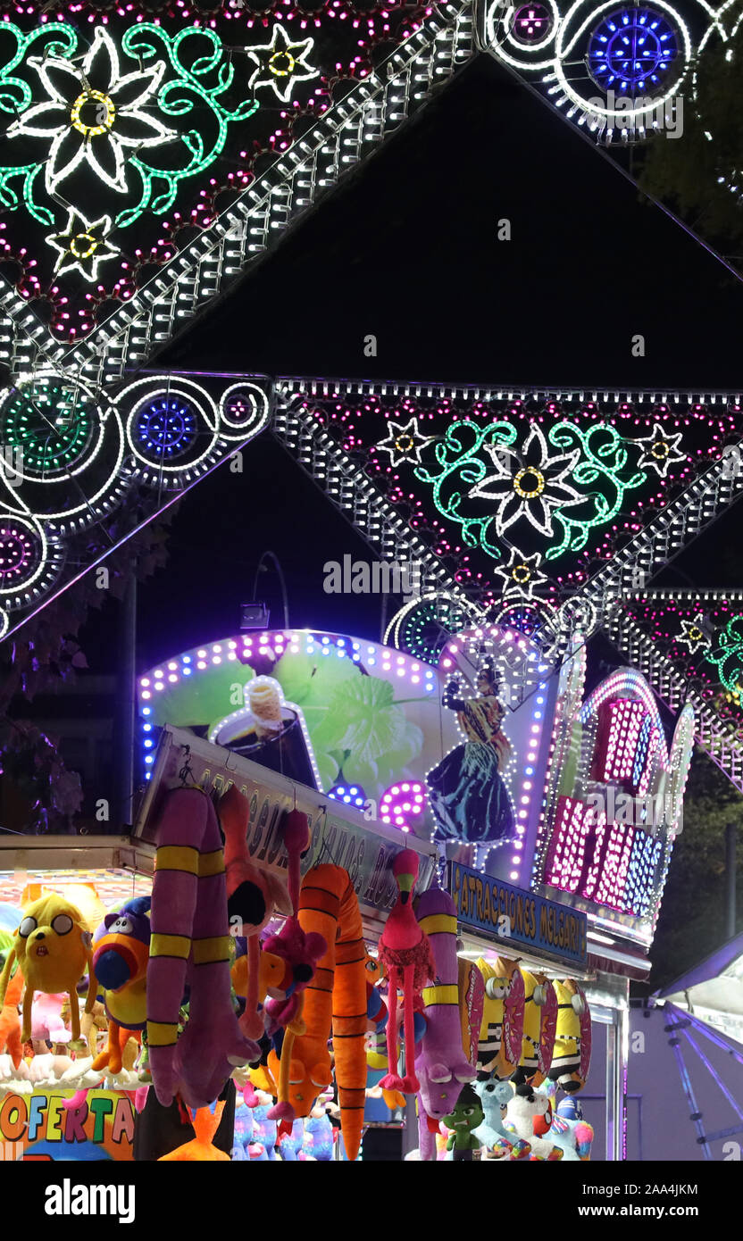 Funfair. Fun fair. Fairground attraction. Lights. Stall selling soft ...