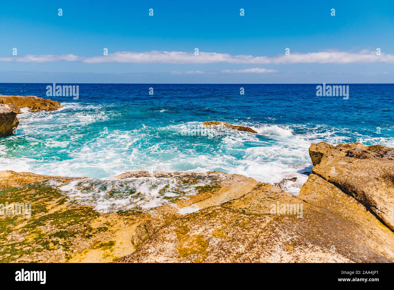 Background natural beautiful turquoise sea water with rocks and rocky ...
