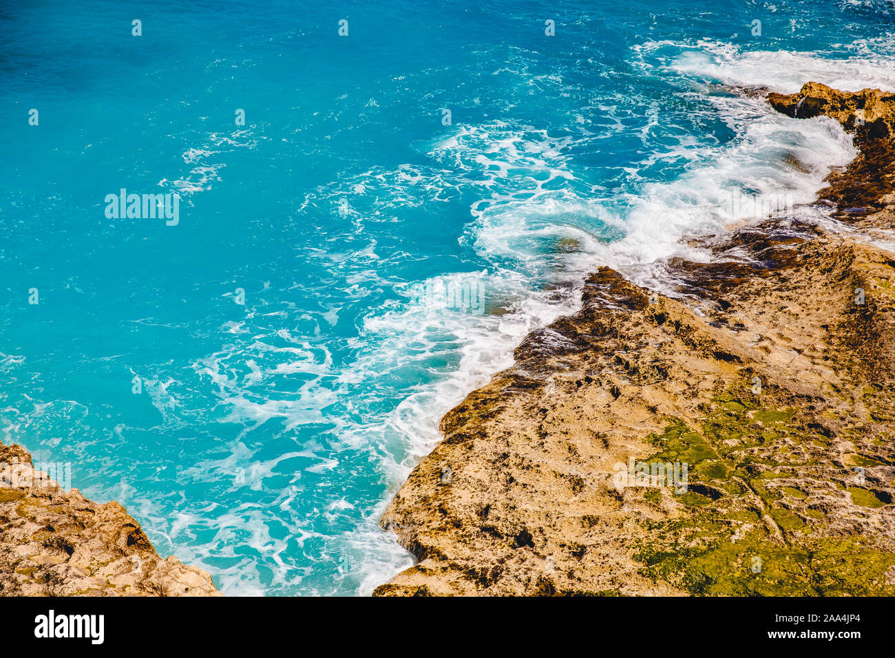 Background natural beautiful turquoise sea water with rocks and rocky ...