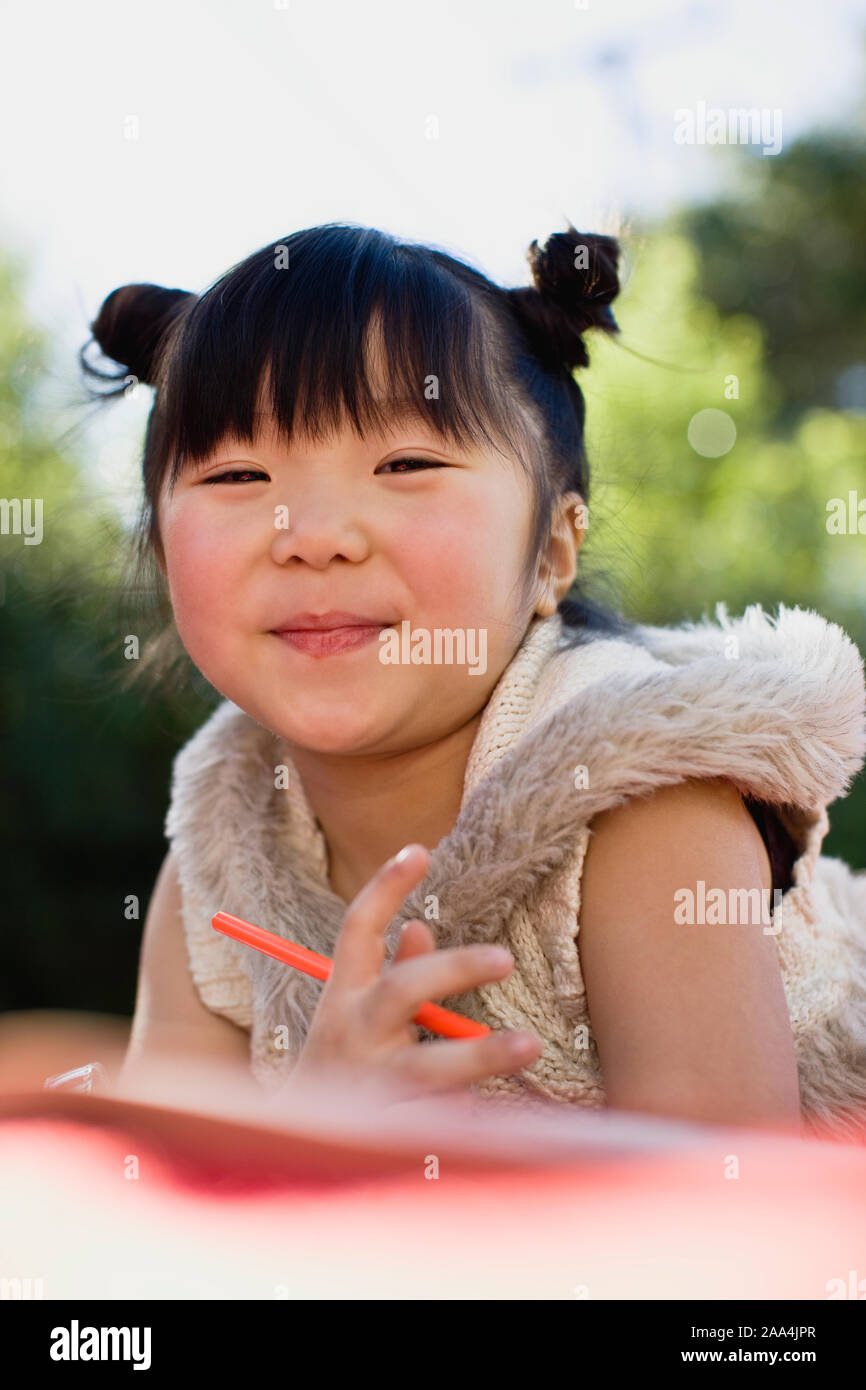 Young girl coloring Stock Photo - Alamy