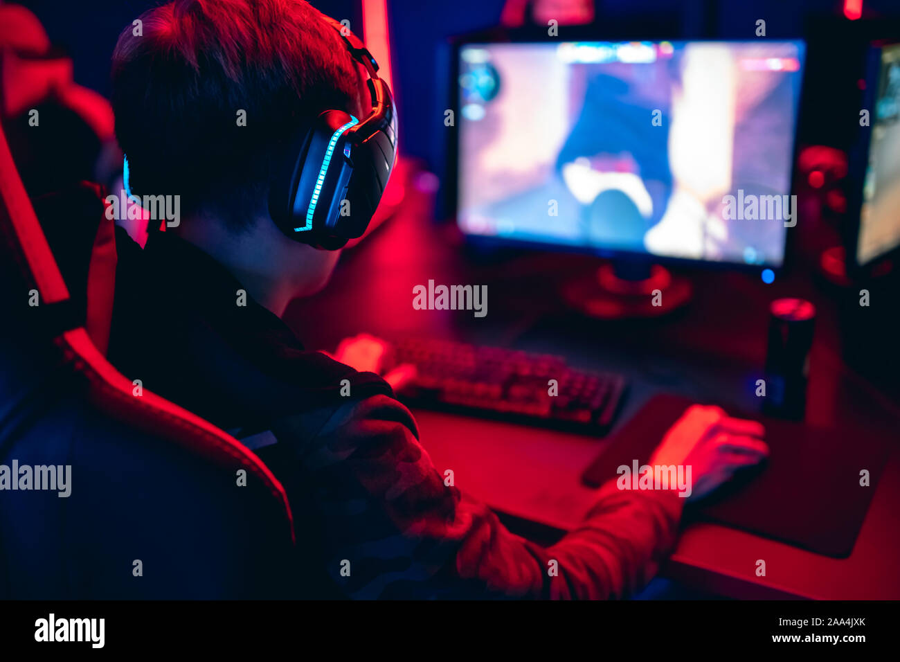 Professional gamer playing online games tournaments pc computer with ...