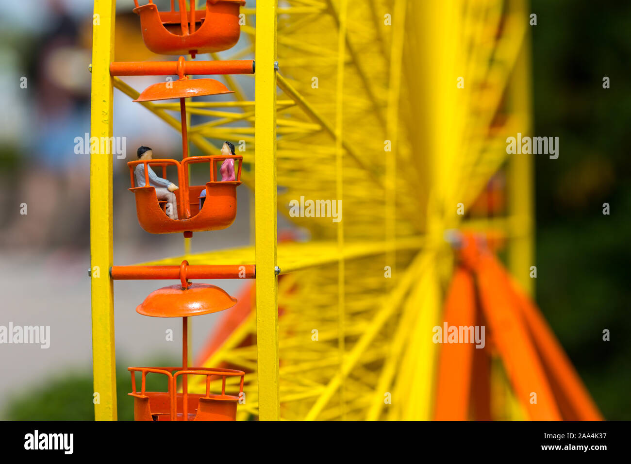 Love couple riding a ferris wheel, miniature scene Stock Photo - Alamy