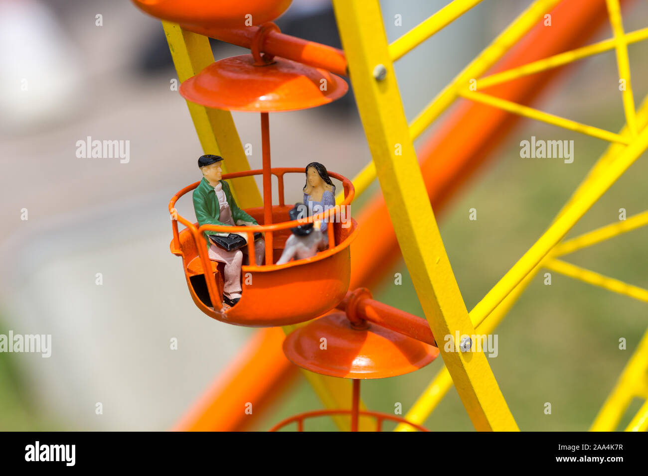 Love couple riding a ferris wheel, miniature scene Stock Photo - Alamy