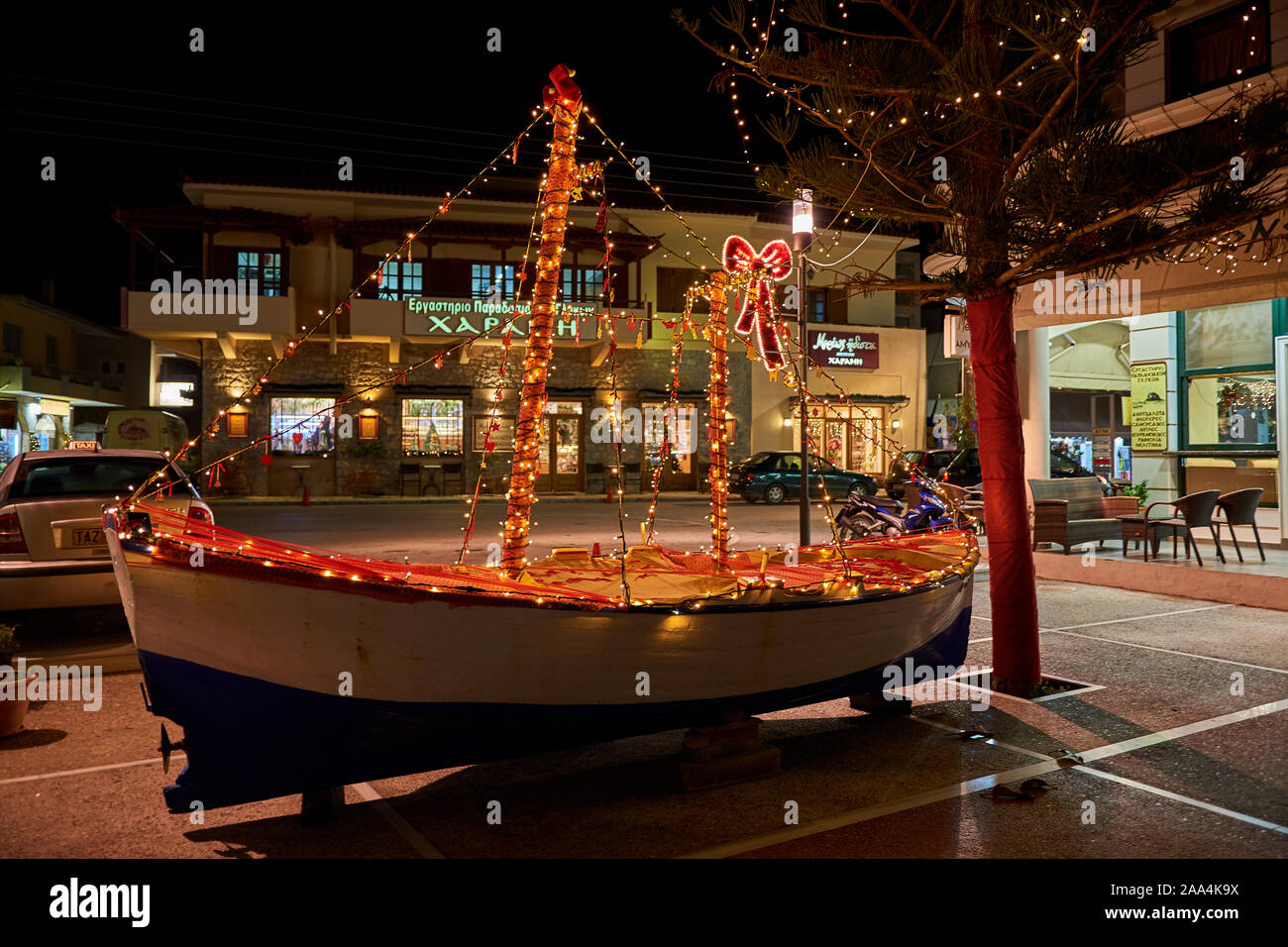 Wooden Christmas ship decorated at night. In the Greek tradition ...