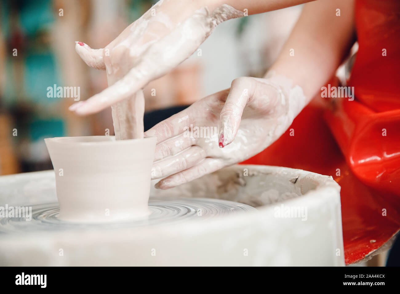 Turkish master paints and cuts clay plate patterns. Concept craft Stock ...