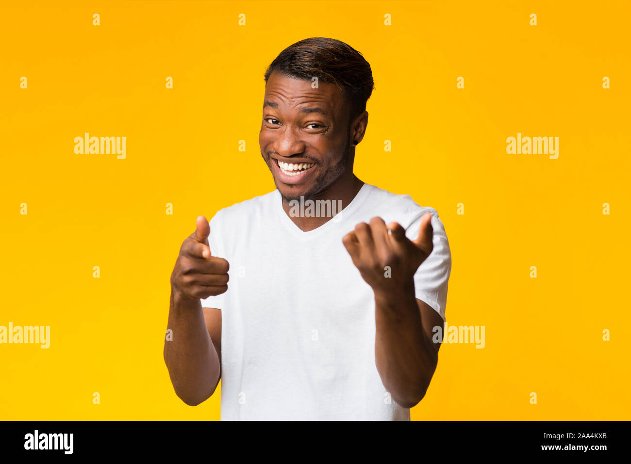 Funny Afro Guy Pointing Fingers At Camera, Studio Shot Stock Photo - Alamy