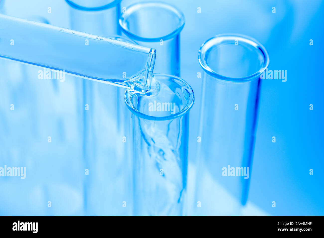 Science laboratory test blue tubes, macro flask equipment. Chemical ...