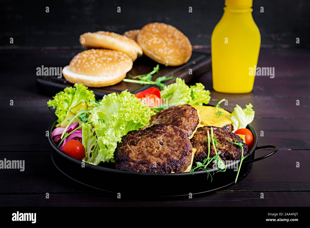 Burger cooking - burger with beef, tomato, cheese, pickled cucumber and ...