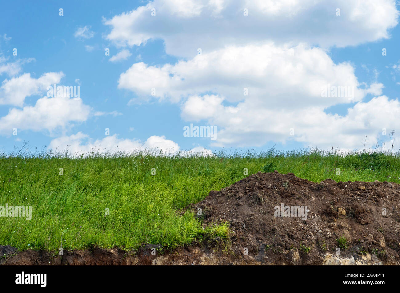 The dug-out land began construction of the road against the blue sky ...