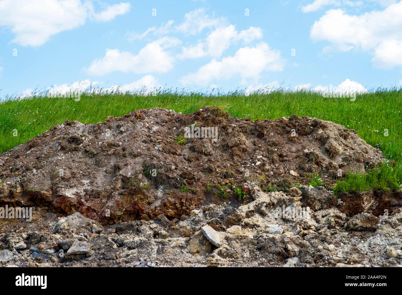 The dug-out land began construction of the road against the blue sky ...