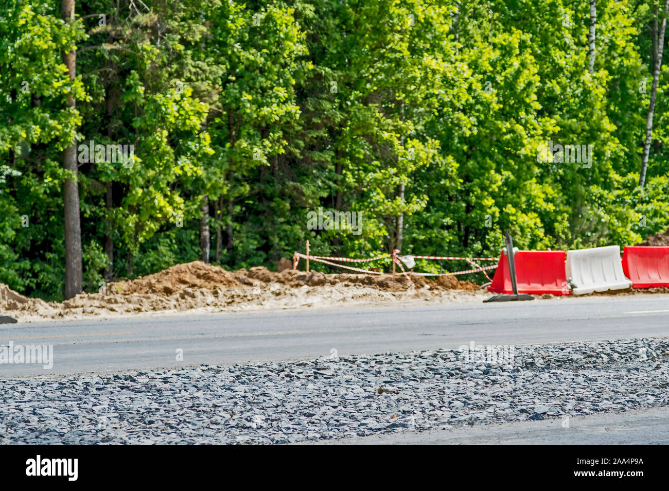 The construction of the road, fencing the roadside during the laying of ...