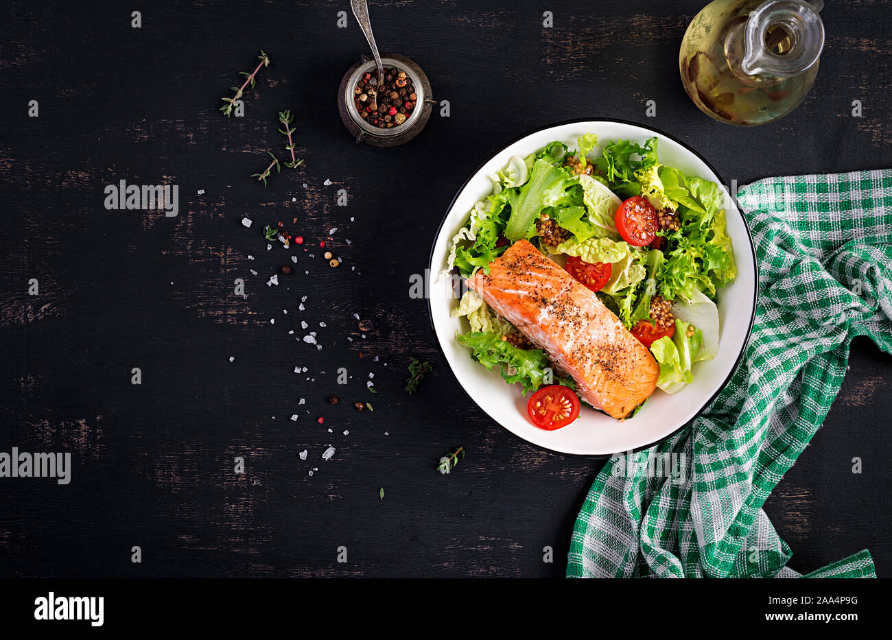 Baked salmon fillet with fresh vegetables salad. Top view, overhead ...