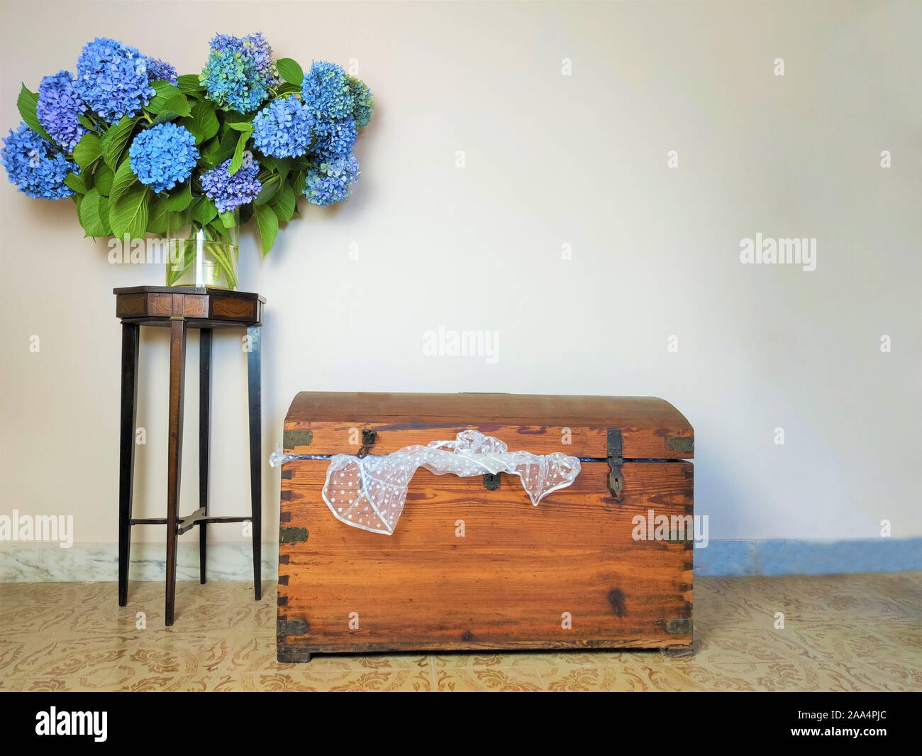 old wooden vintage chest, vase with blue hydrangea flowers Stock Photo ...