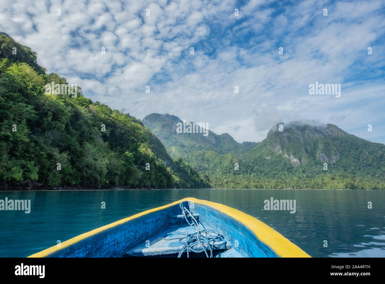 Boat sailing in ocean, Ora Beach, Seram, Maluku Islands, Indonesia ...