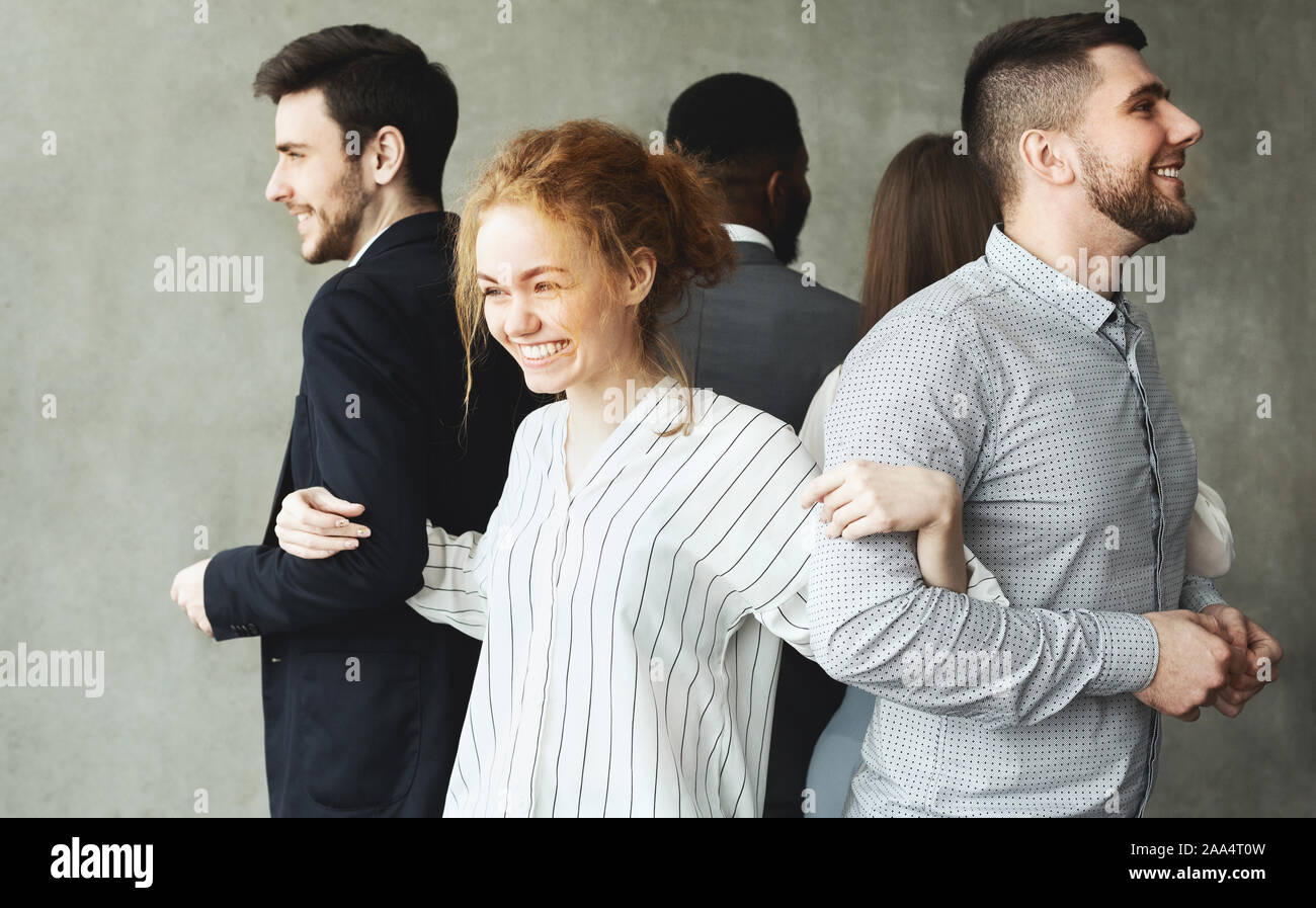 Business team standing in circle back to back Stock Photo - Alamy
