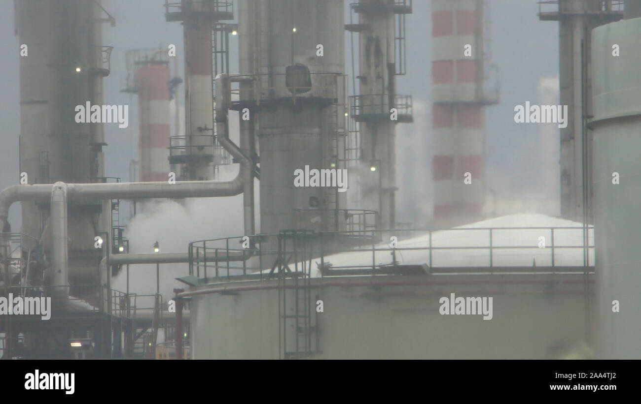 Acid rain, air emissions from an oil refinery. Smoke and pollution come ...