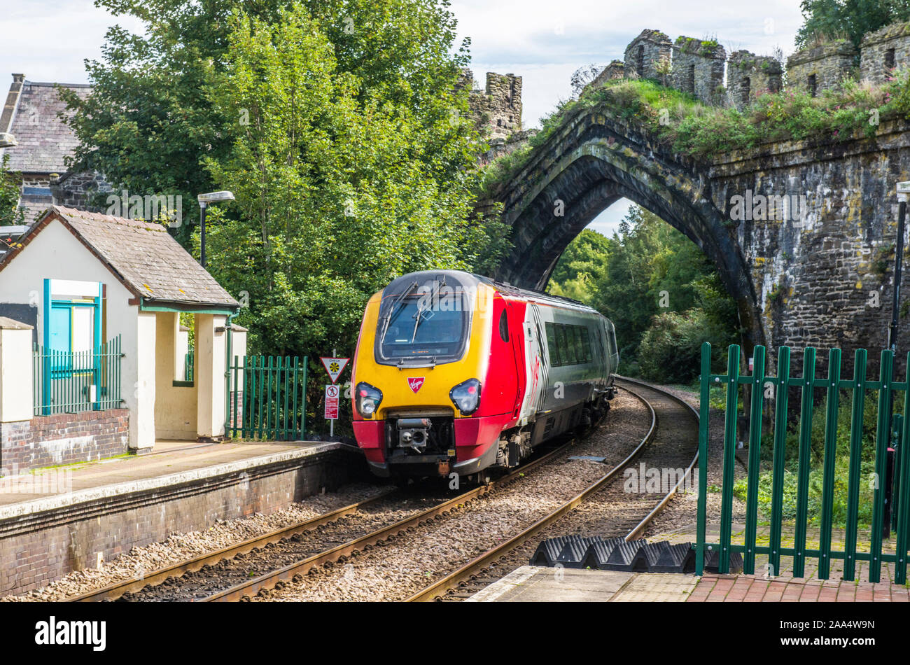 Diesel Train standing at Conwy Railway Station in North Wales, in red ...