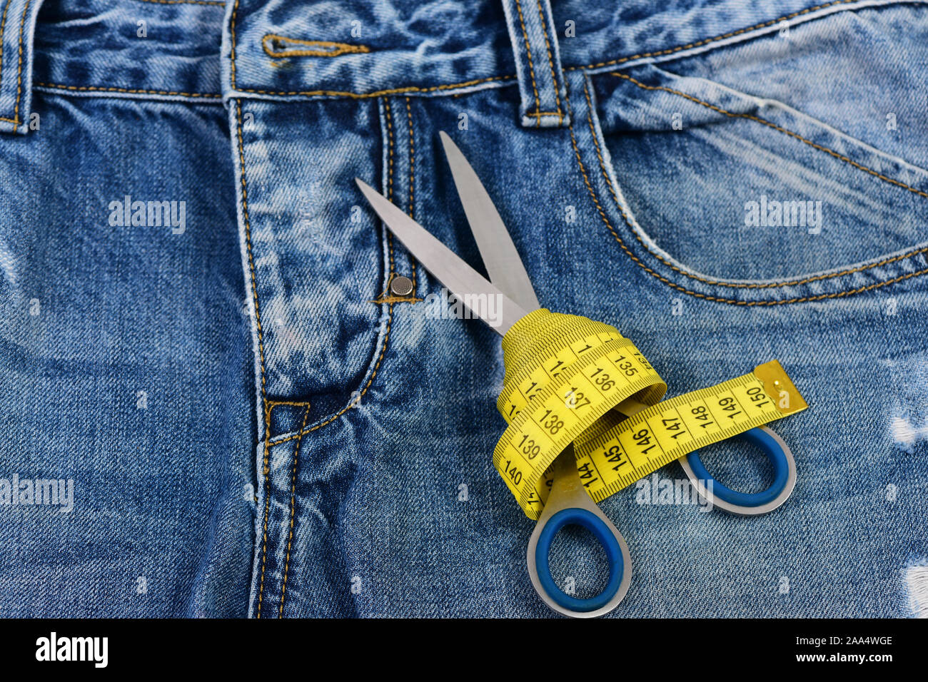 Tailors tools on denim fabric, selective focus. Making clothes and ...