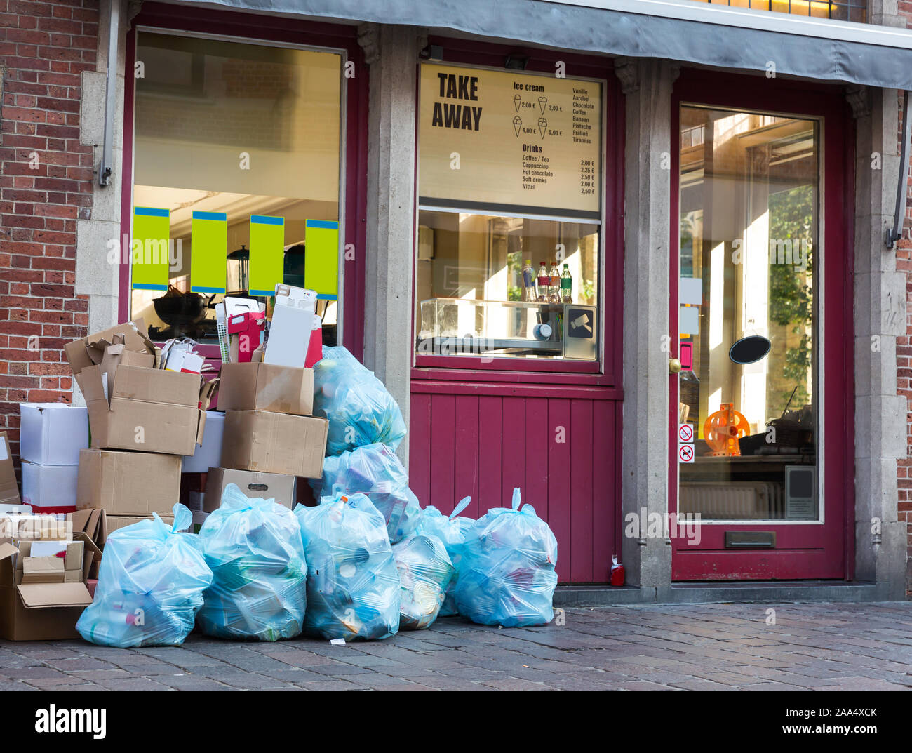 Blue garbage bags and boxes on sidewalk, Europe Stock Photo - Alamy